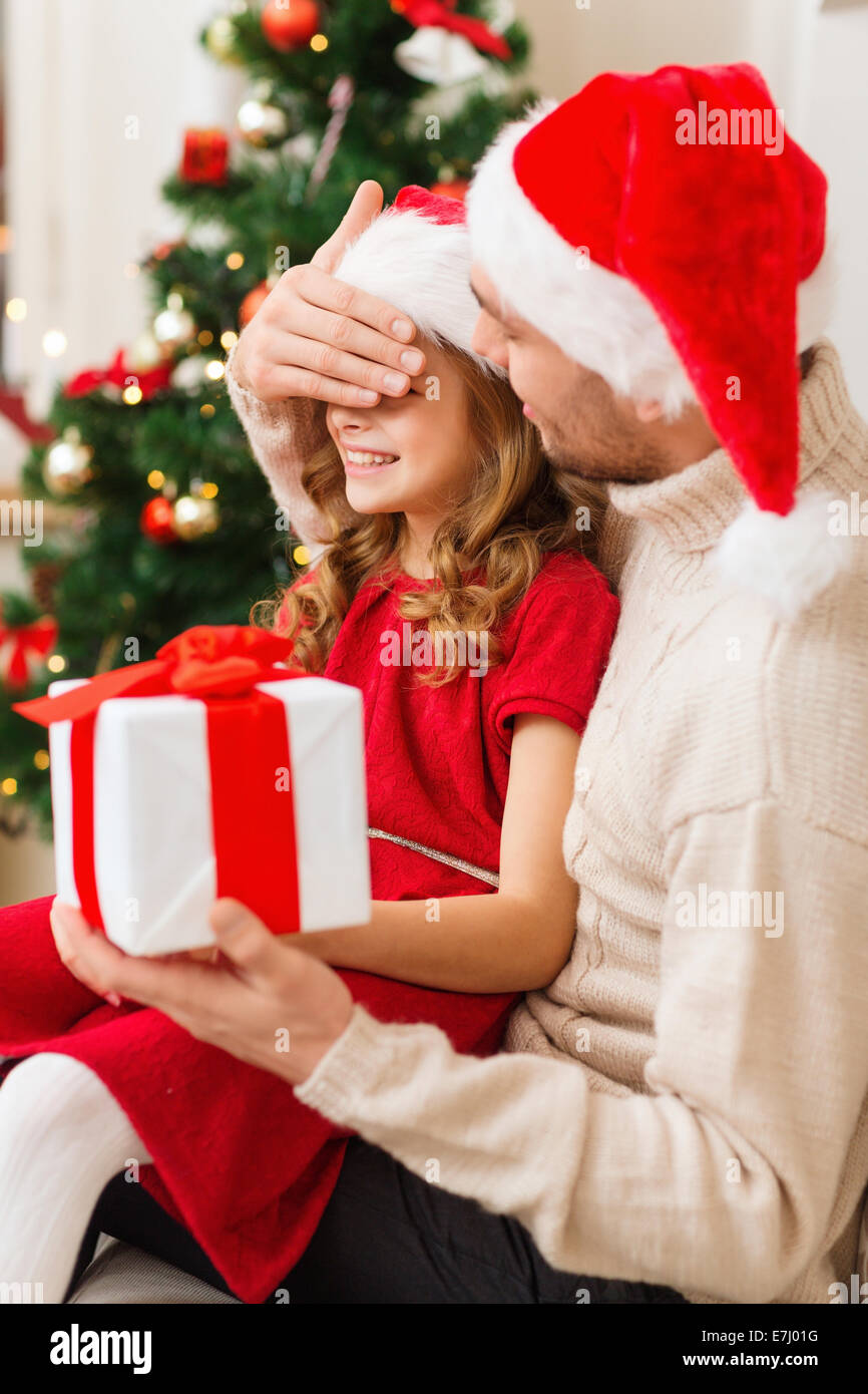smiling father surprises daughter with gift box Stock Photo - Alamy