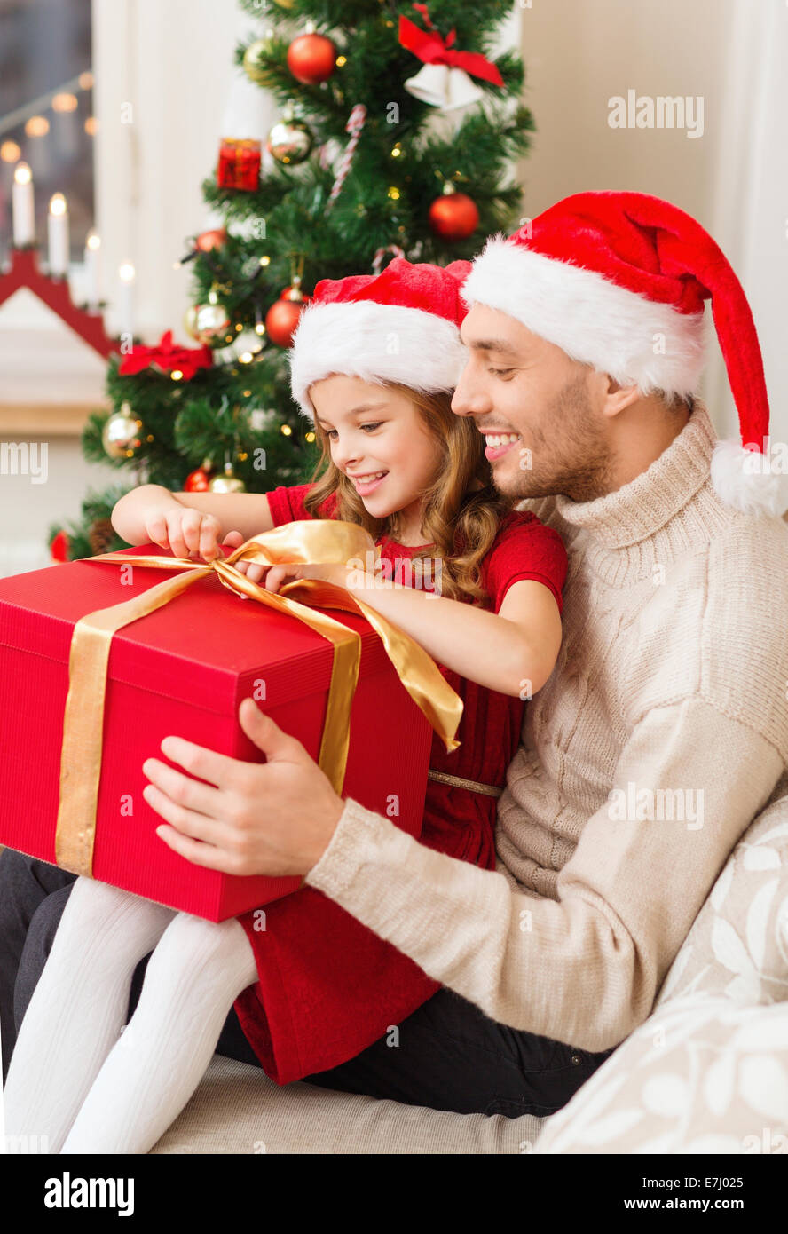 smiling father and daughter opening gift box Stock Photo - Alamy