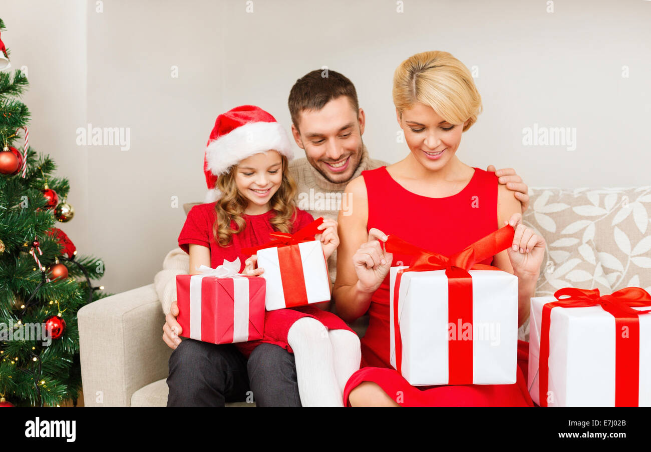 happy family opening gift boxes Stock Photo - Alamy