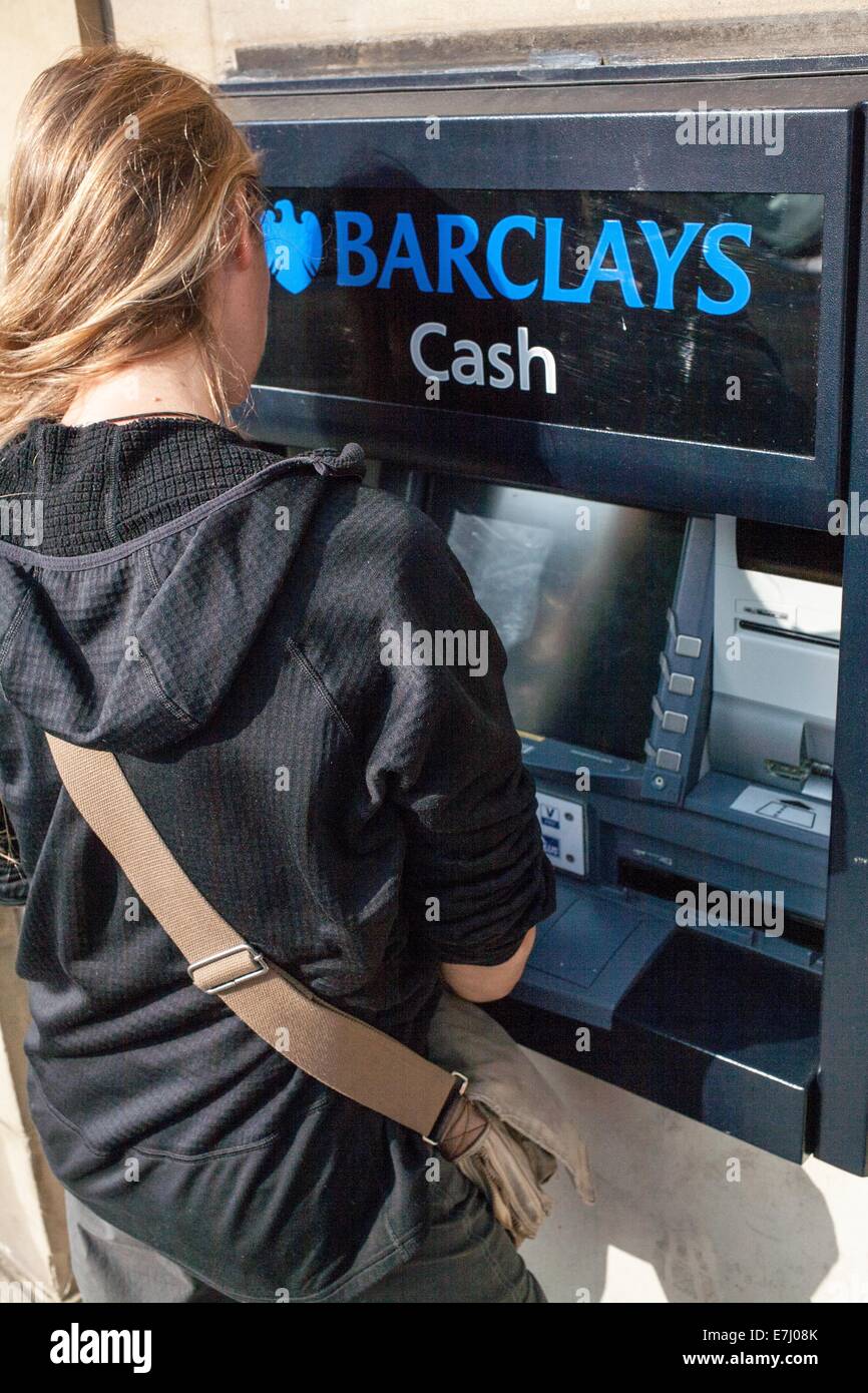 A customer using an atm hi-res stock photography and images - Alamy
