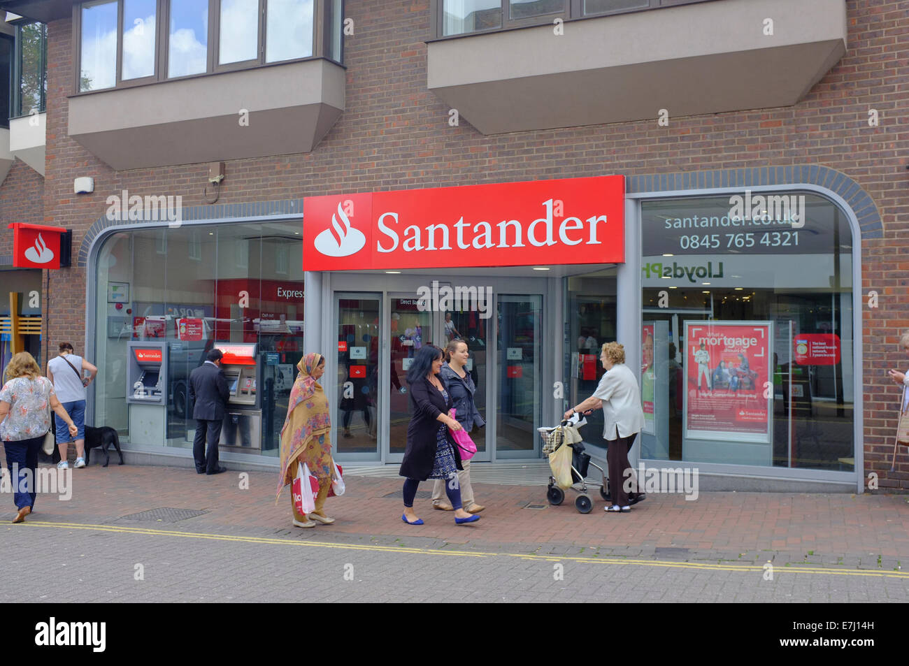 Santander Bank with people walking past in Aylesbury Stock Photo - Alamy