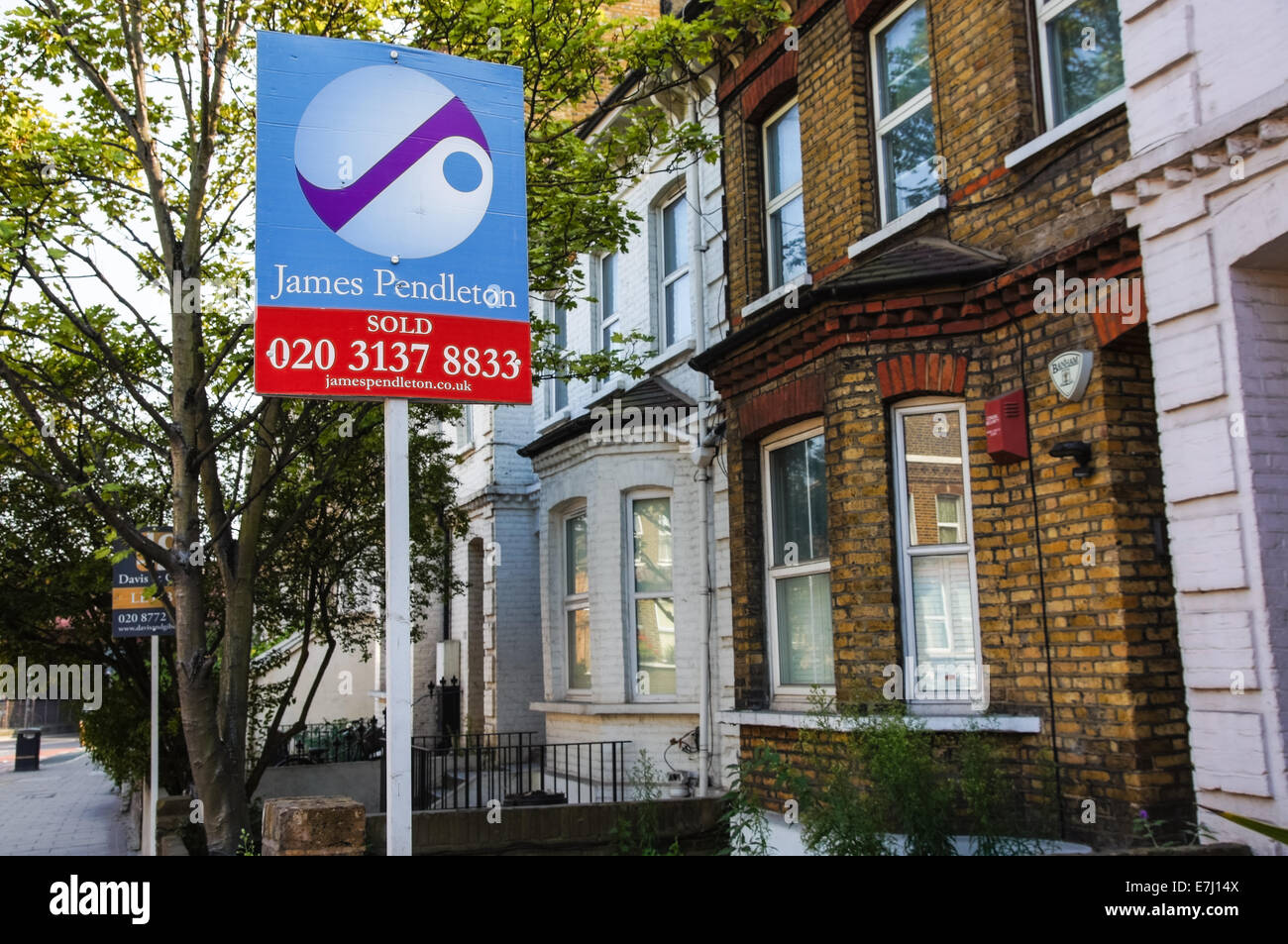 A real estate sign To Let outside terraced houses in South London ...