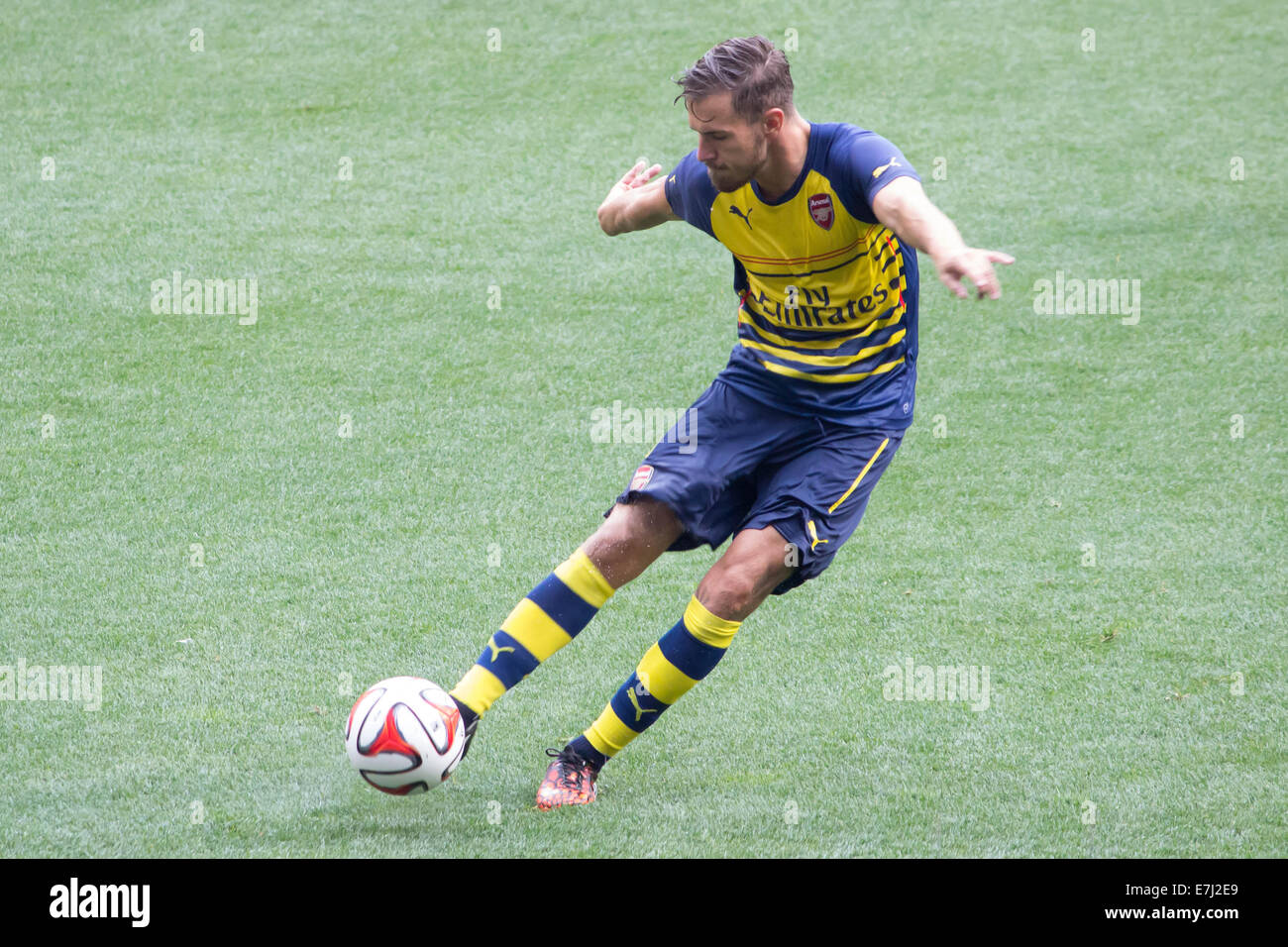 This image shows Arsenal FC Aaron Ramsey taking a shot on goal during a ...