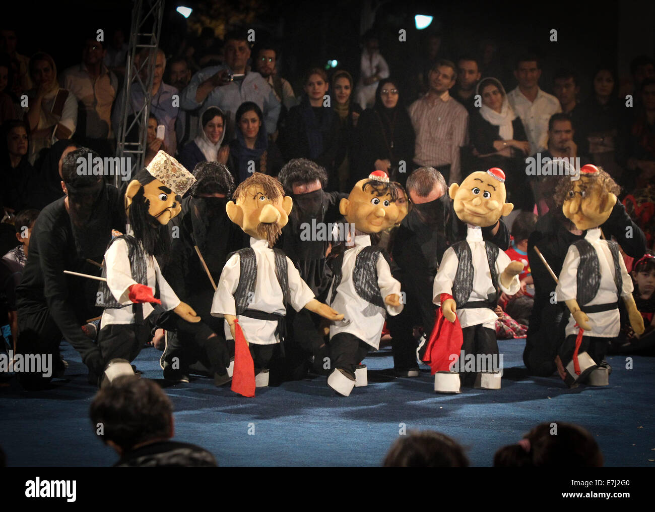 Tehran, Iran. 18th Sep, 2014. Actors perform a puppet show during the ...