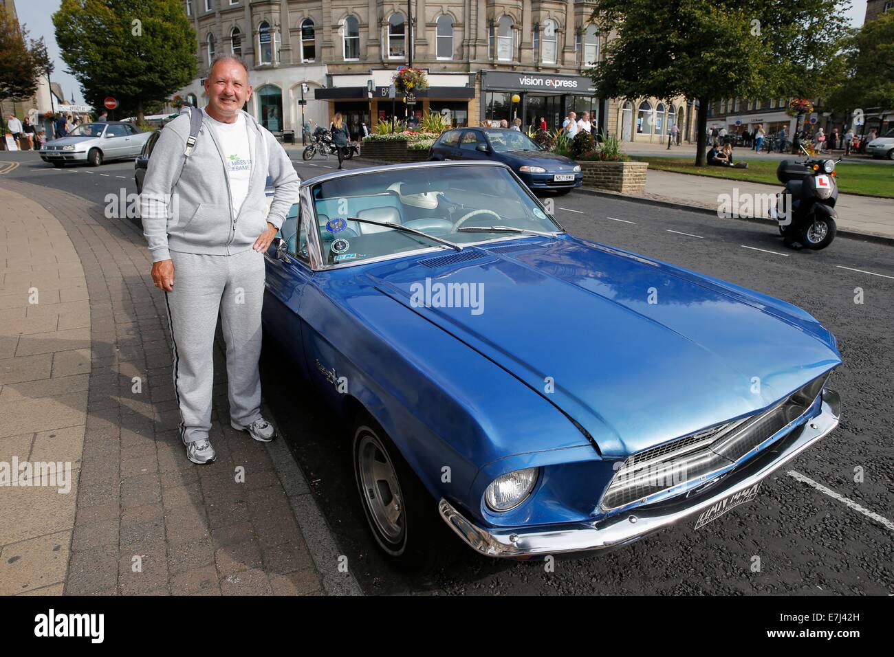 Proud man with his vintage blue Ford Mustang car in Harrogate Stock ...