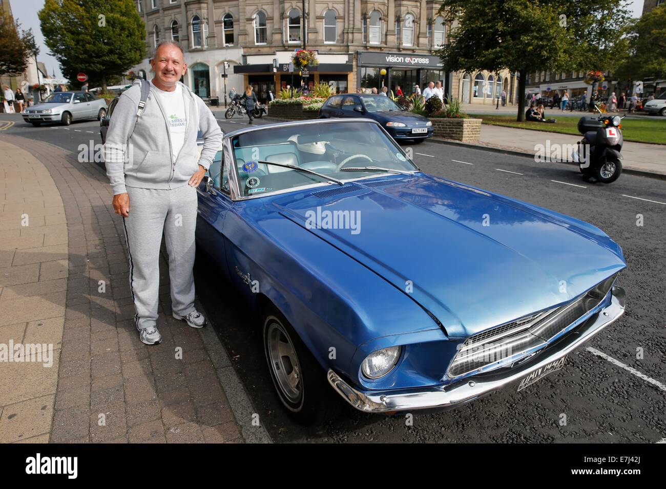 Proud man with his vintage blue Ford Mustang car in Harrogate Stock ...