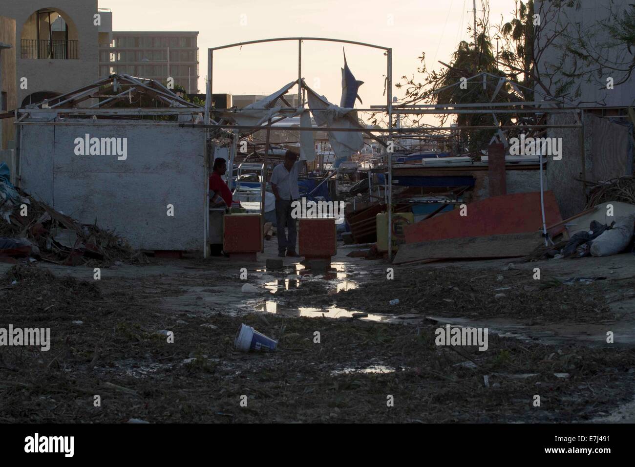 Los Cabos, Mexico. 18th Sep, 2014. A man watches the damage in the pier ...