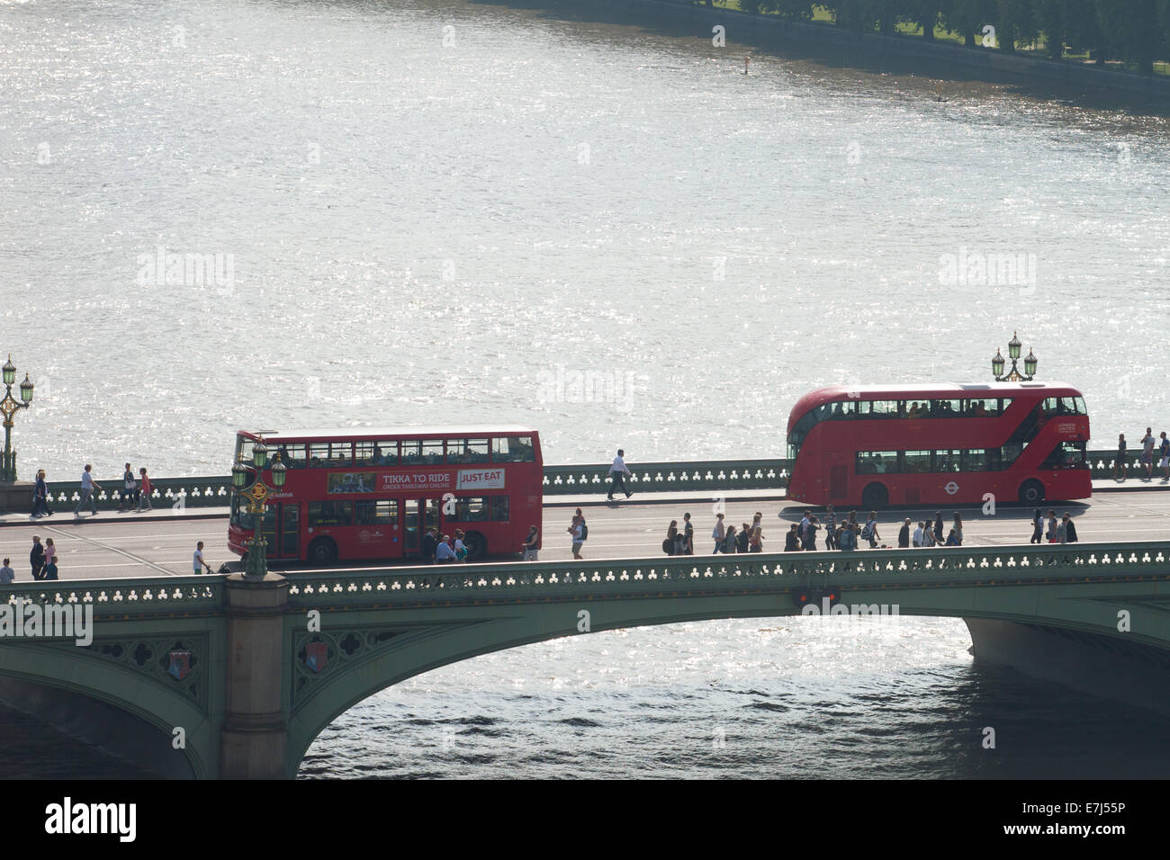London buses on Westminster Bridge over The river Thames, London,UK ...