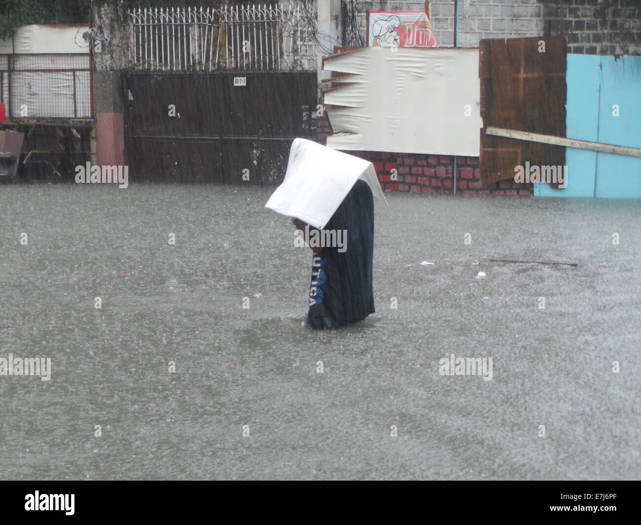 Typhoon Mario caused flooding in Quezon City as its estimated rainfall ...