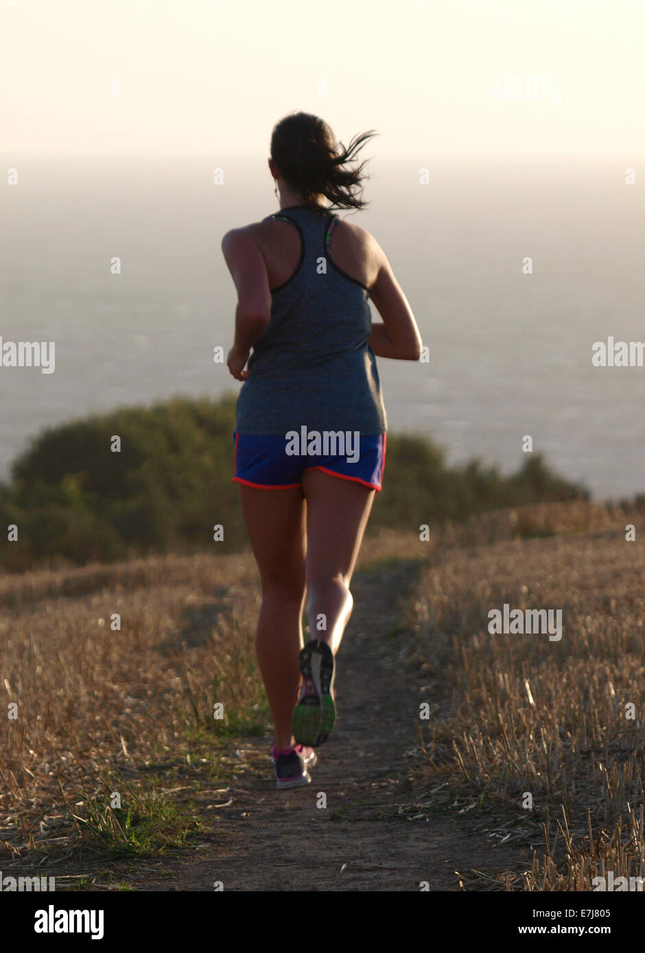 Female runner, Bude, Cornwall, UK Stock Photo - Alamy