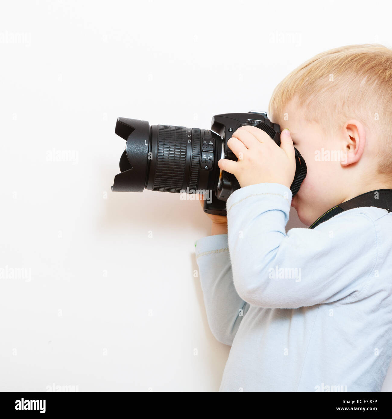 Happy childhood. Boy child kid playing with camera. Preschooler taking ...