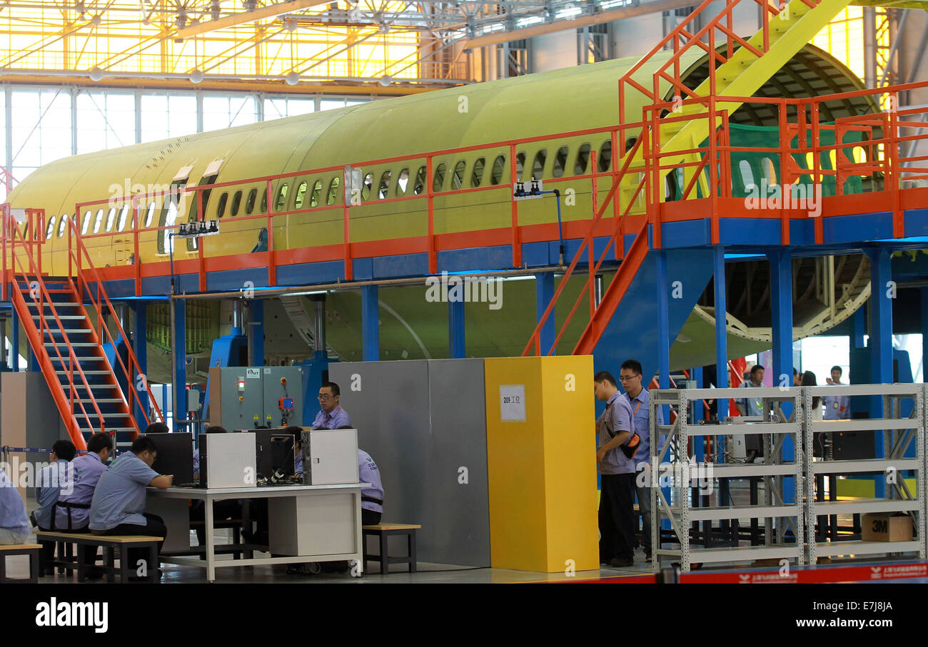 Shanghai, China. 19th Sep, 2014. Technicians assemble fuselage of C919 ...