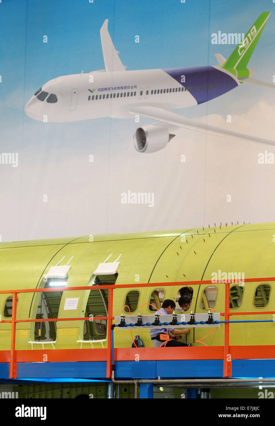 Shanghai, China. 19th Sep, 2014. Technicians assemble fuselage of C919 ...