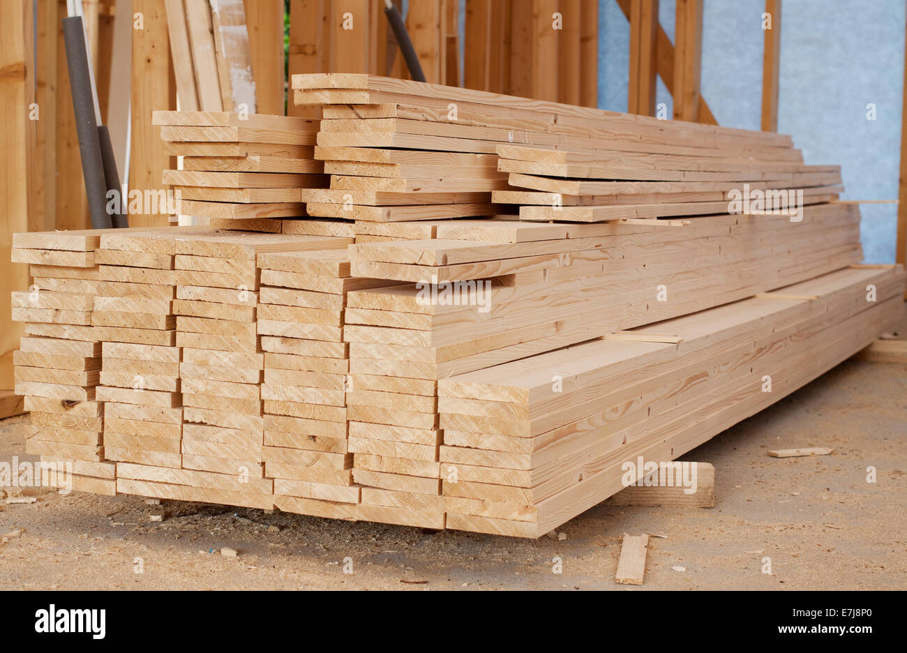 Stack of wooden planks inside house Stock Photo - Alamy