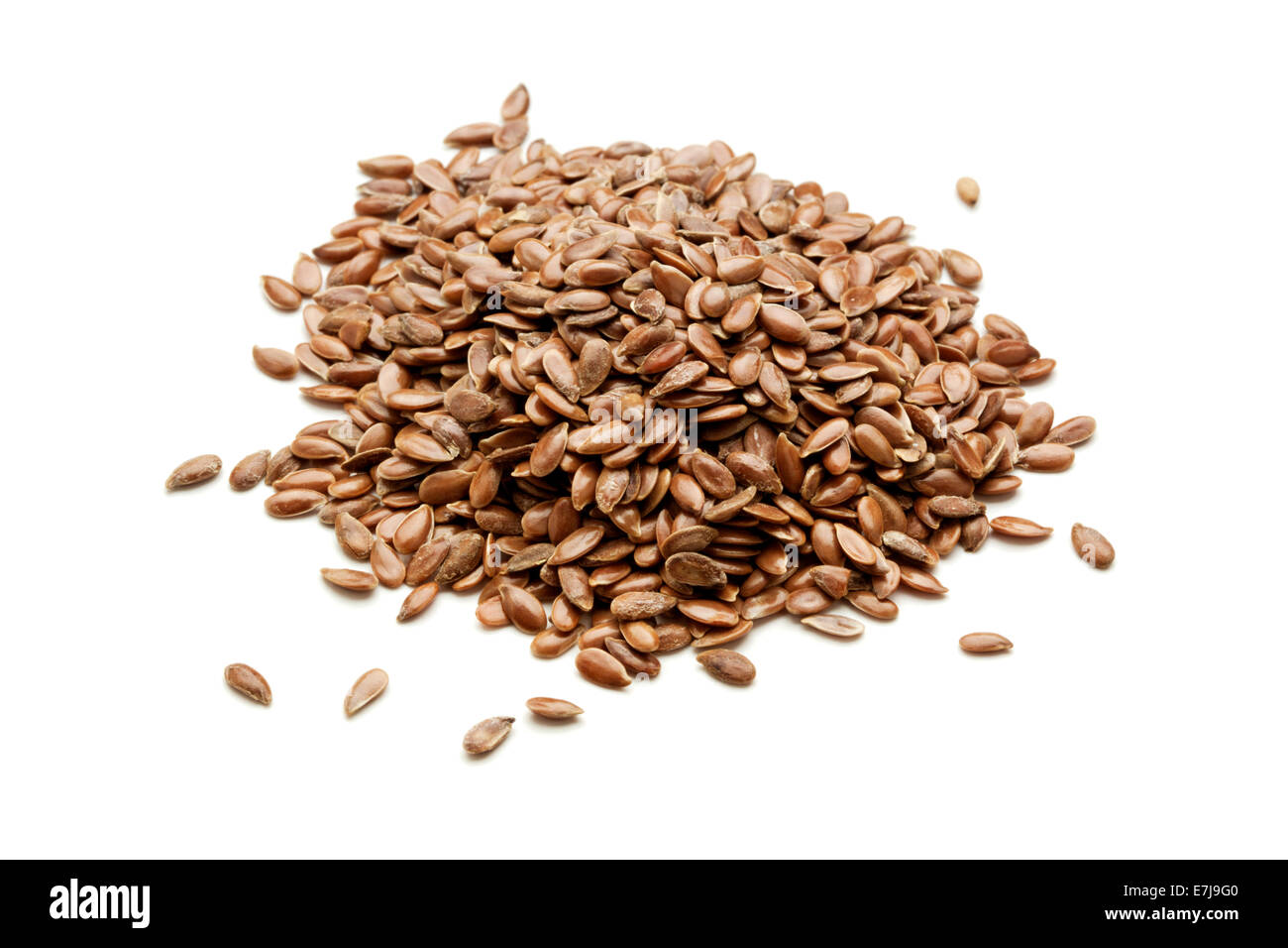heap of linseed grains isolated on white background Stock Photo - Alamy