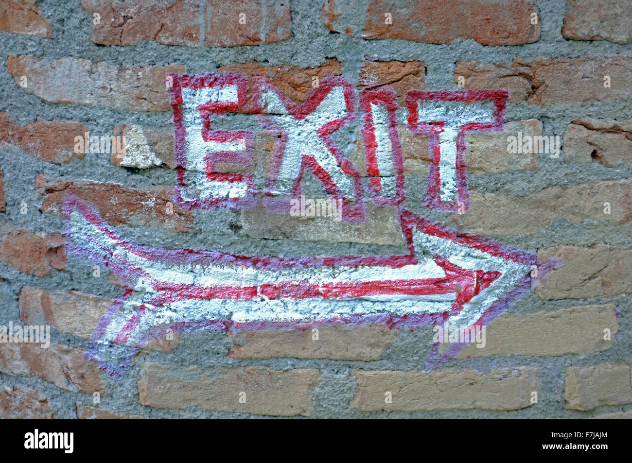 Hand painted exit sign on wall Stock Photo - Alamy