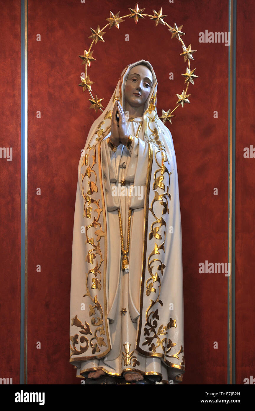Sculpture of the Virgin Mary with a circle of stars, halo, in the ...