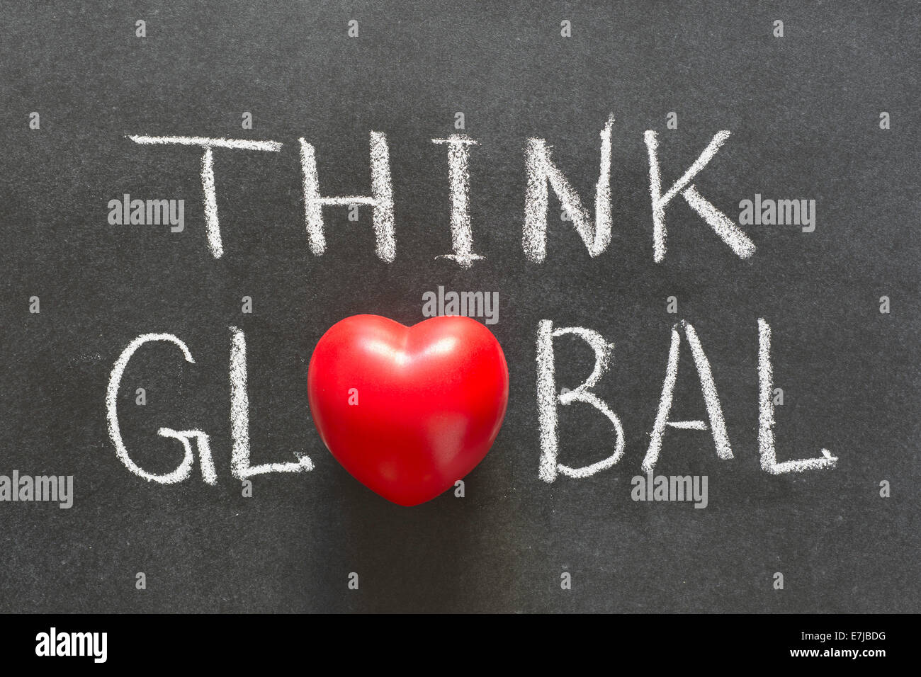 think global phrase handwritten on chalkboard with heart symbol instead ...