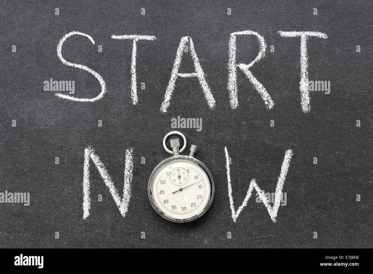 start now concept handwritten on chalkboard with vintage precise ...