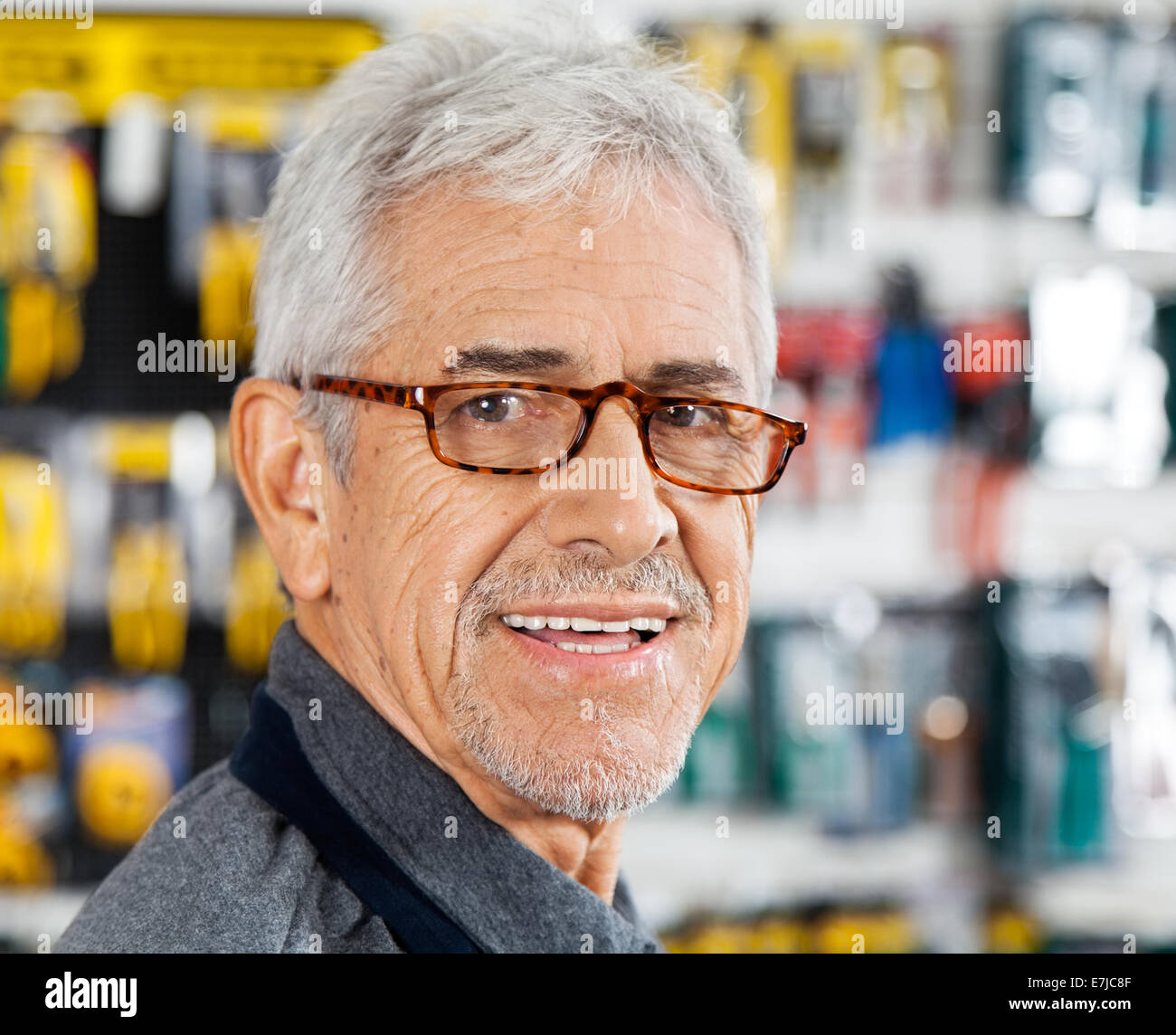 Salesman Smiling In Hardware Store Stock Photo - Alamy