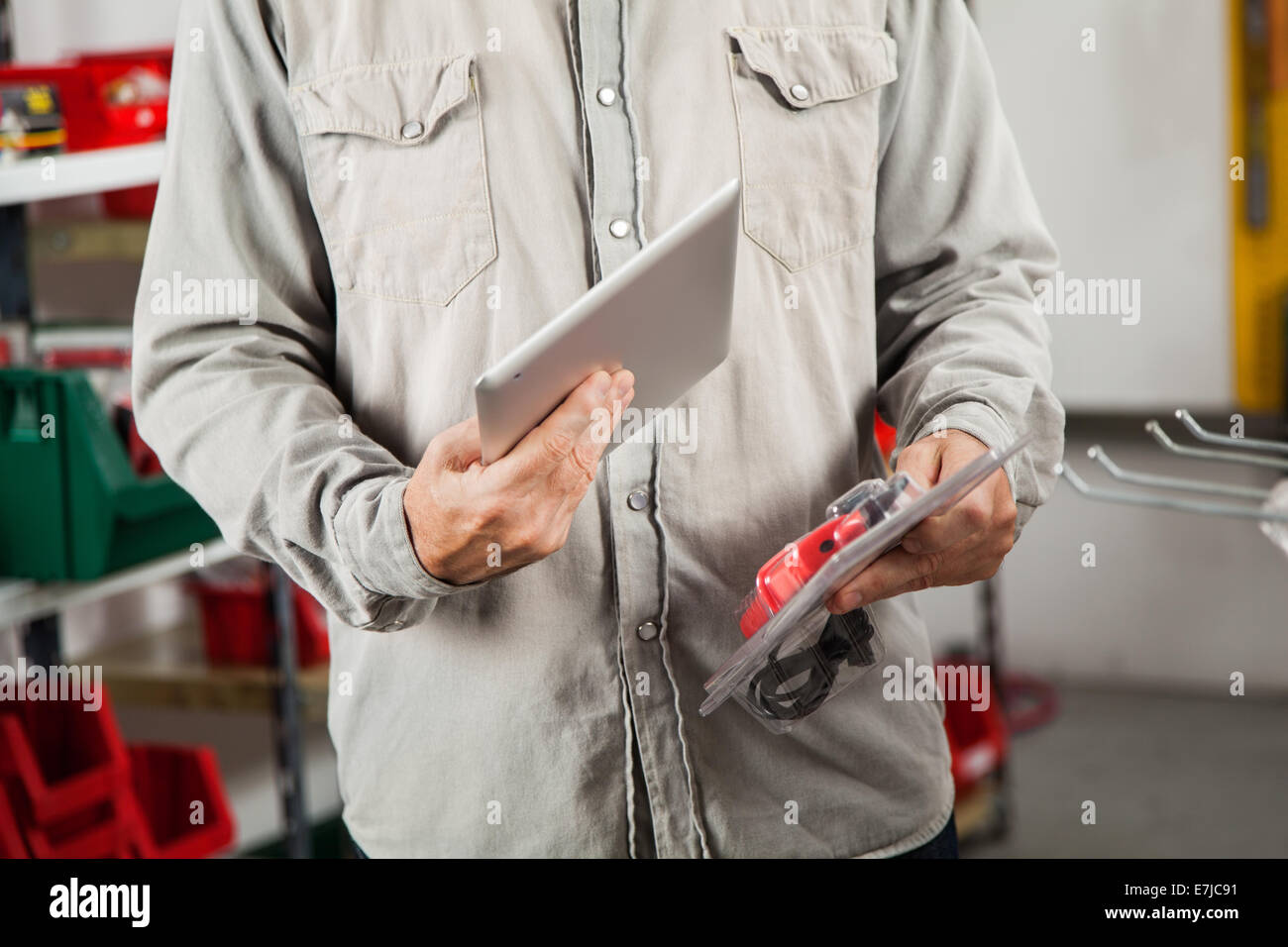 Man Scanning Product Through Digital Tablet Stock Photo - Alamy