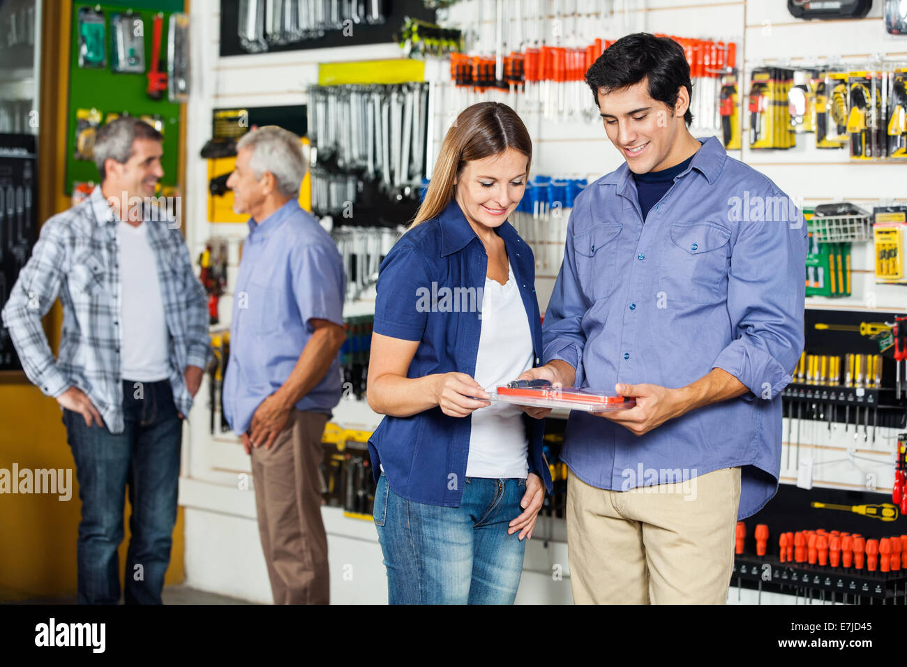 Couple Looking At Tool Set In Hardware Store Stock Photo - Alamy