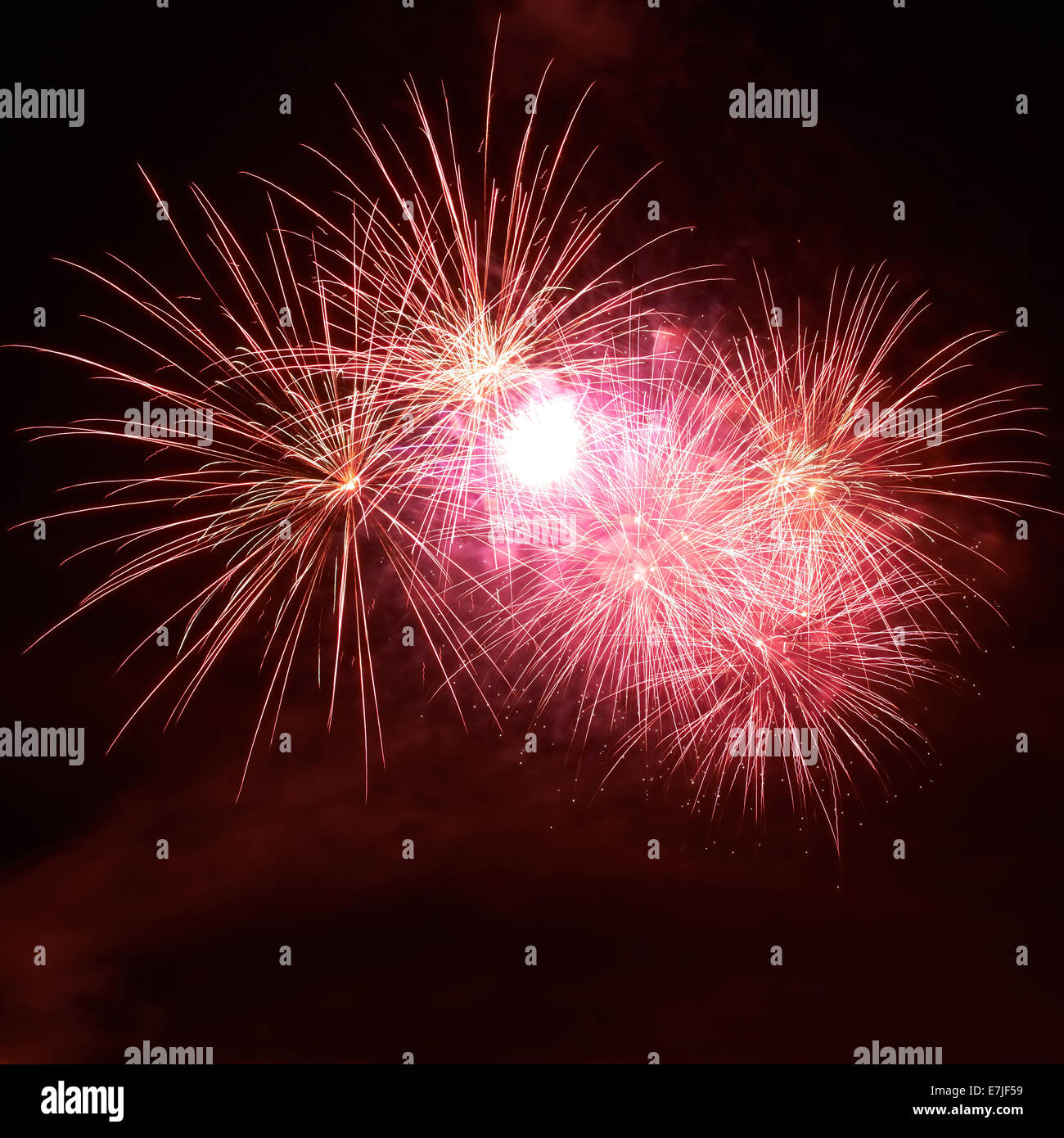 Red colorful fireworks on the black sky background Stock Photo - Alamy