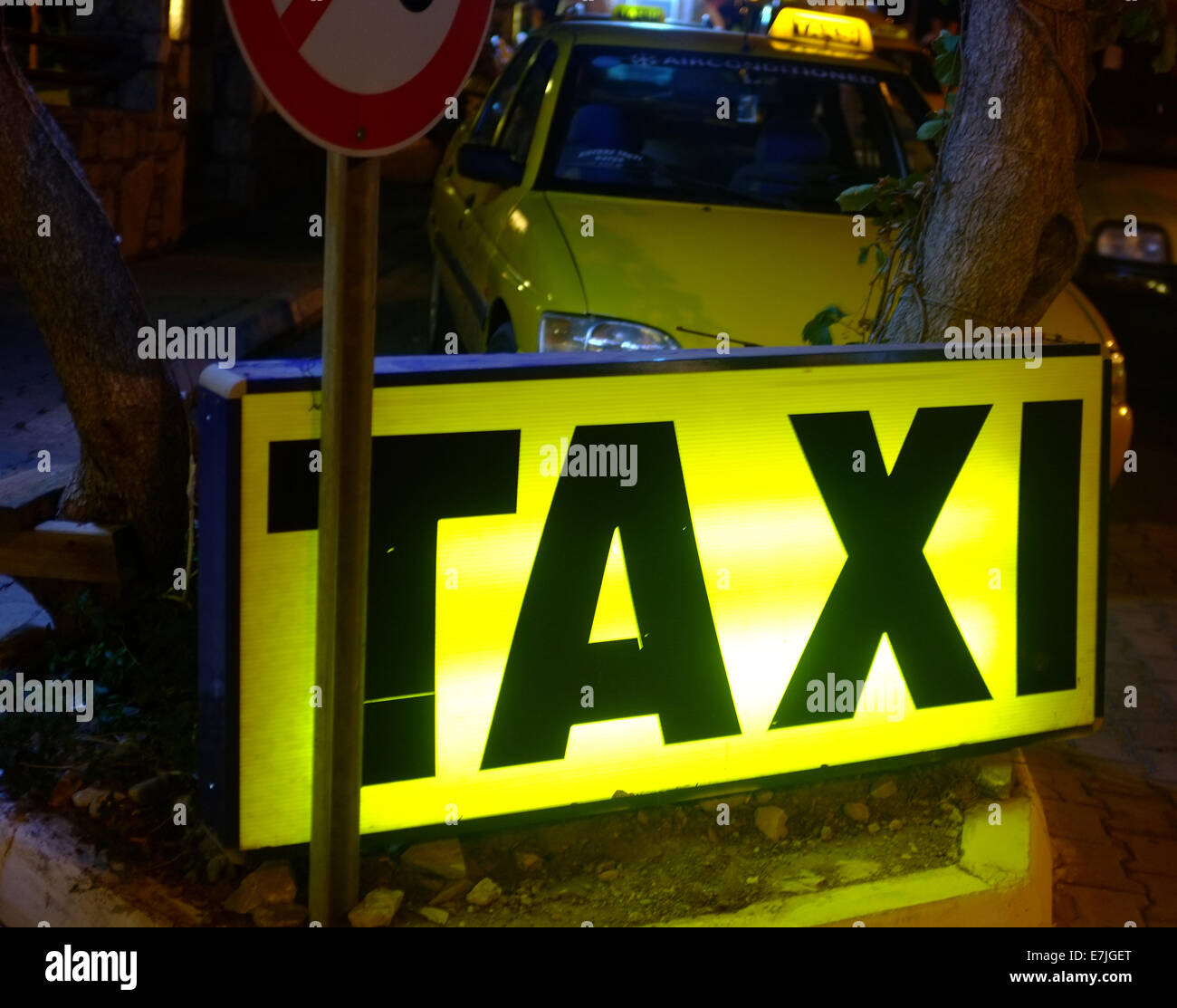 Illuminated taxi sign Stock Photo - Alamy