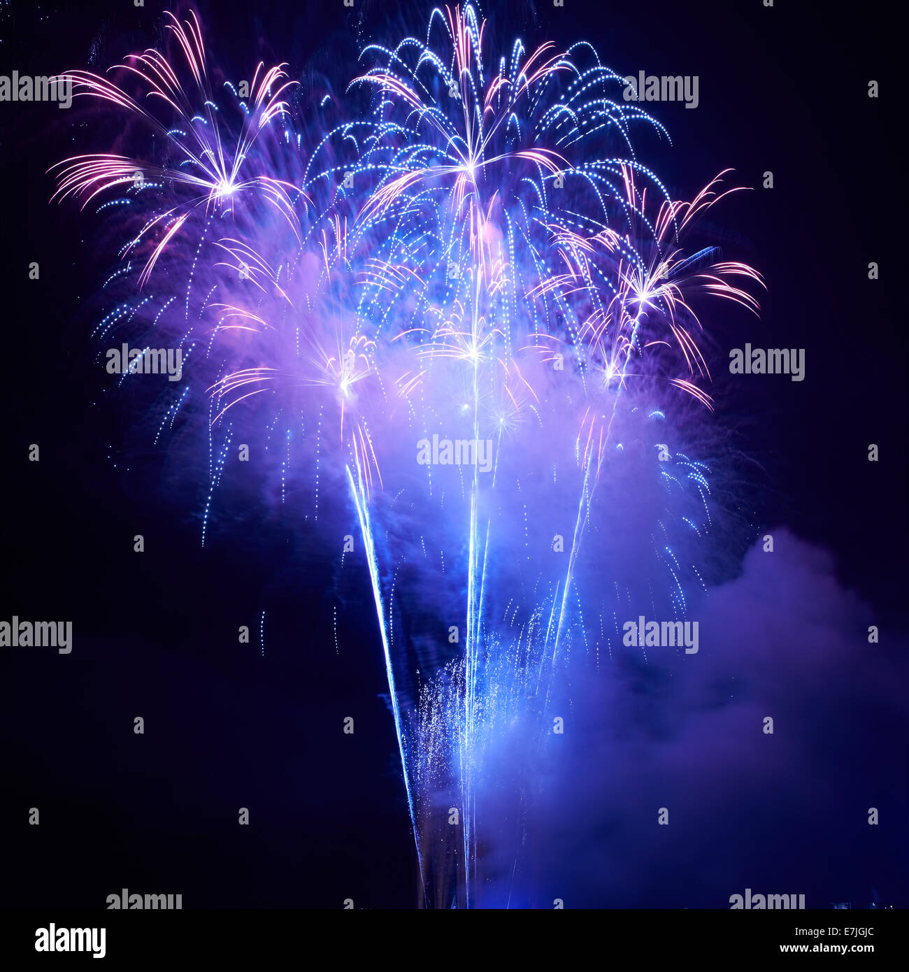 Blue colorful fireworks on the black sky background Stock Photo - Alamy