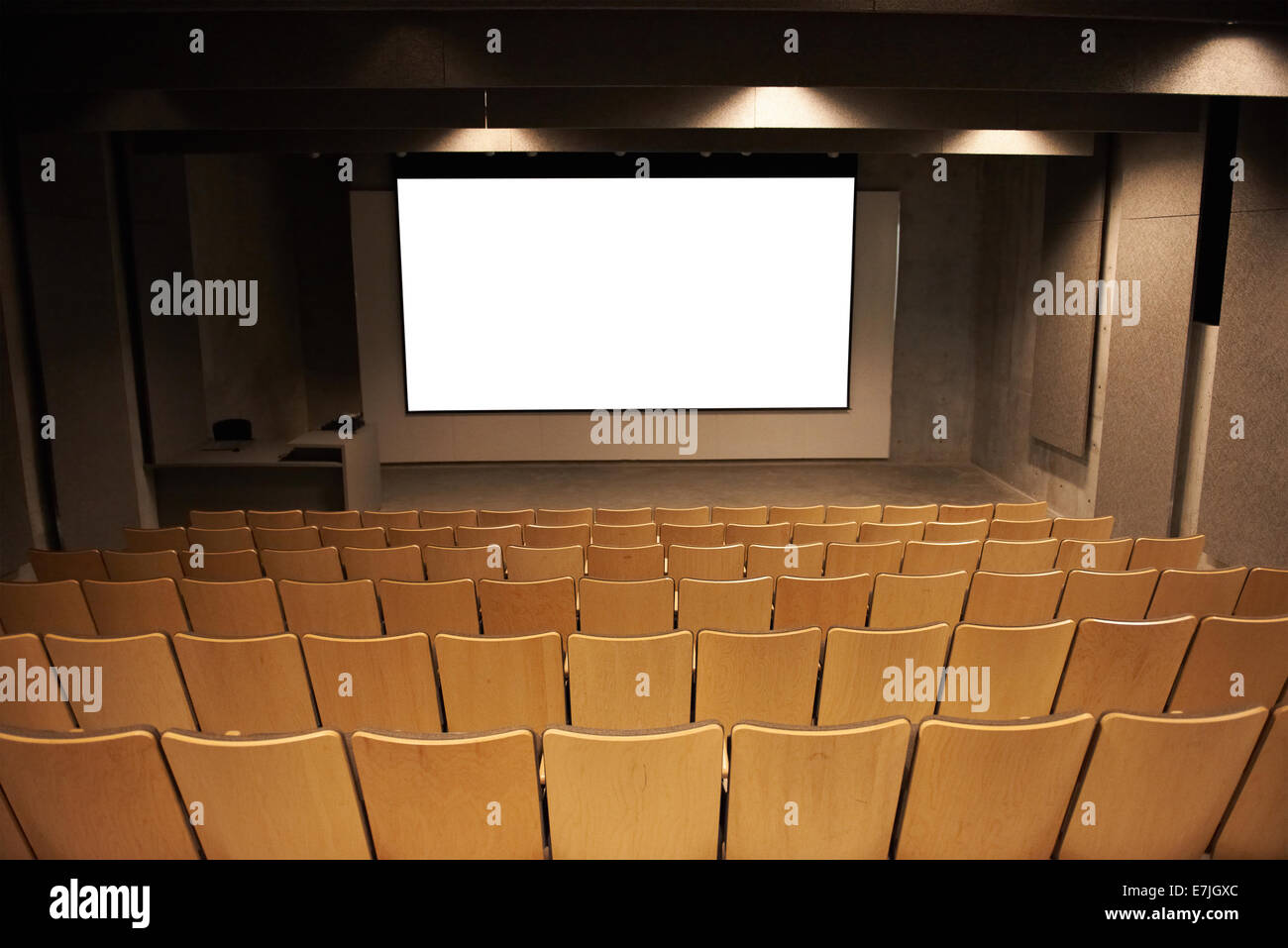 Empty cinema with white isolated screen and brown chairs Stock Photo ...