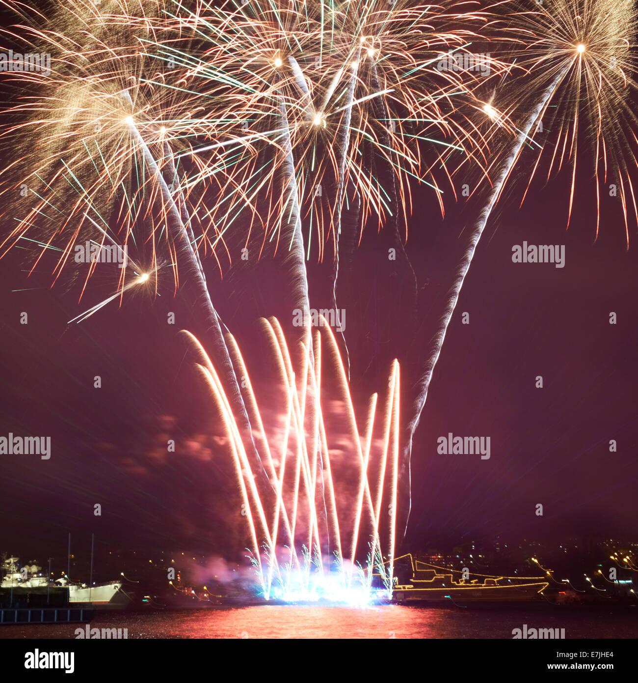 Red colorful fireworks on the black sky background Stock Photo - Alamy