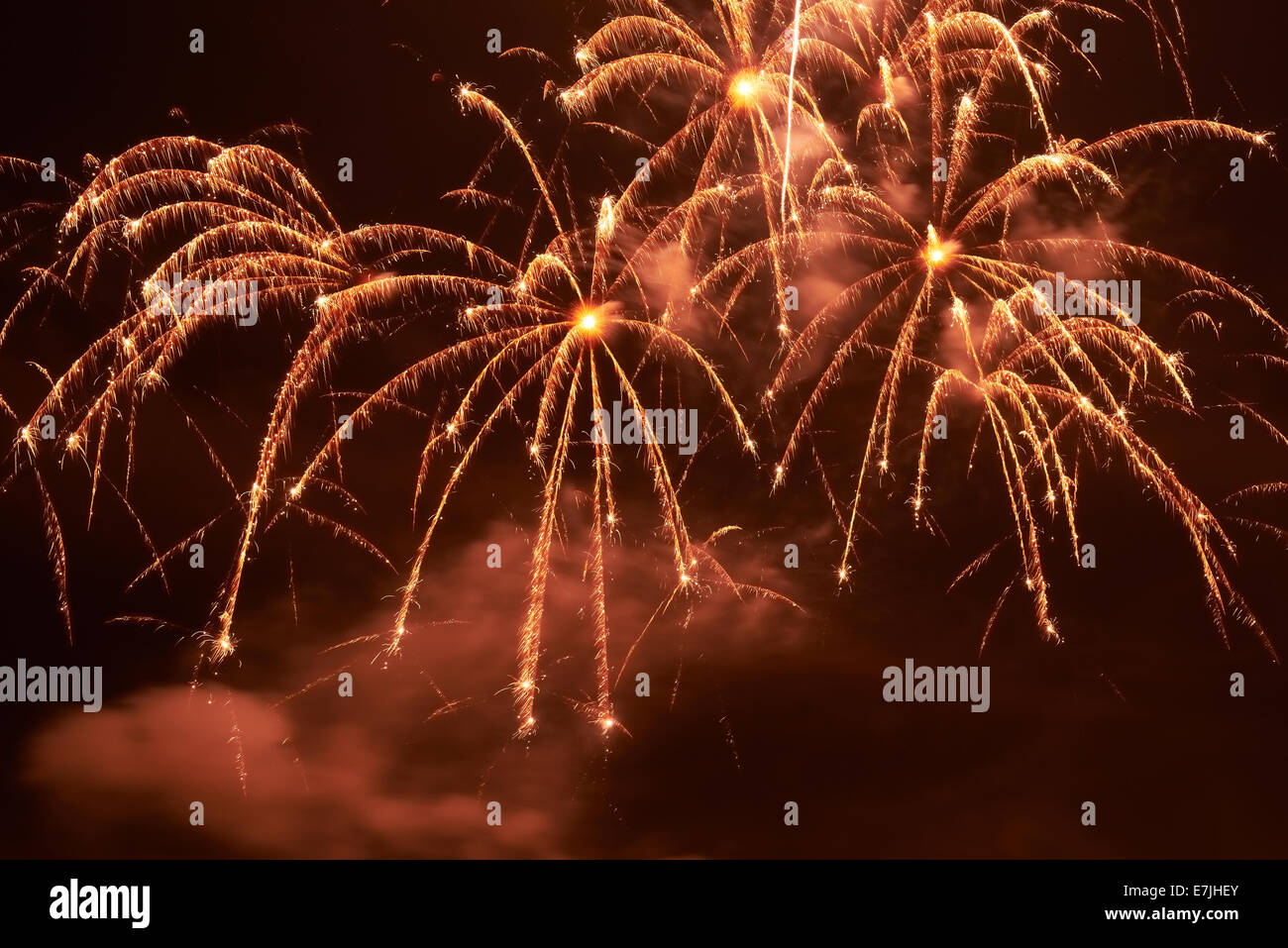 Red colorful fireworks on the black sky background Stock Photo - Alamy