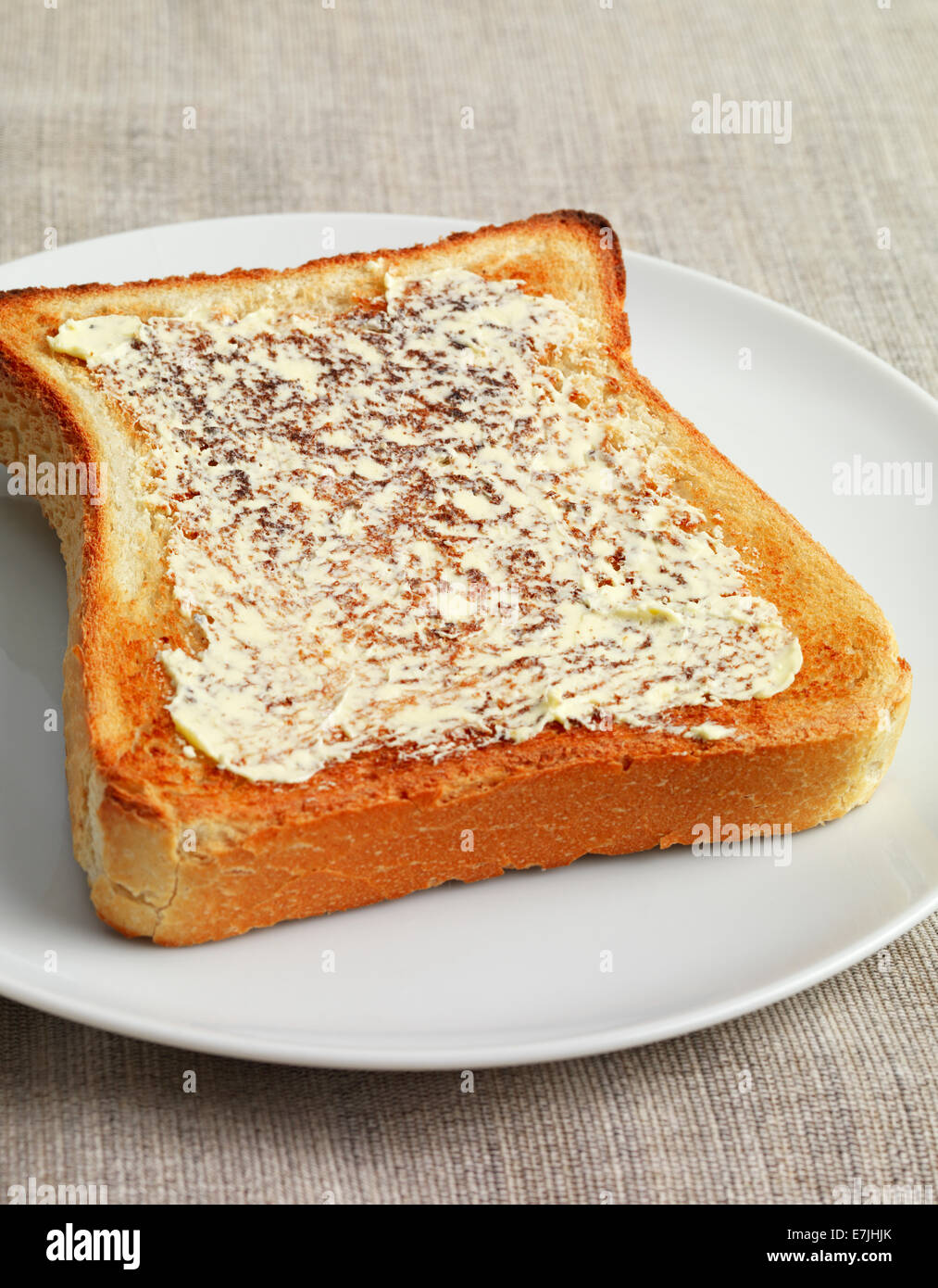 Toast with butter on plate Stock Photo - Alamy