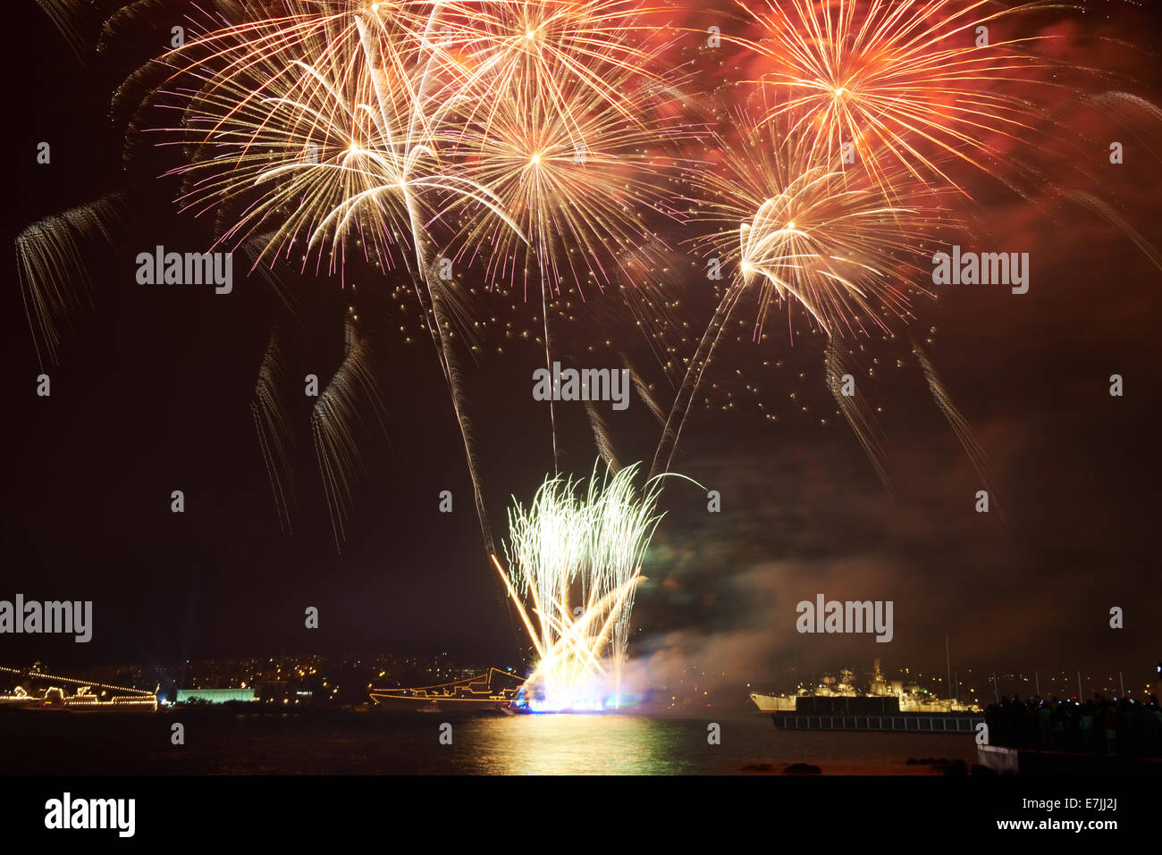 Red colorful fireworks on the black sky background Stock Photo - Alamy