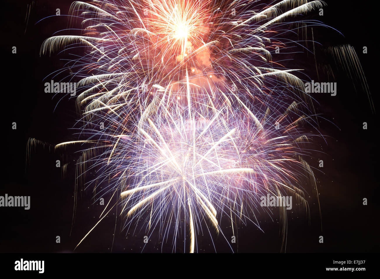 Red colorful fireworks on the black sky background Stock Photo - Alamy