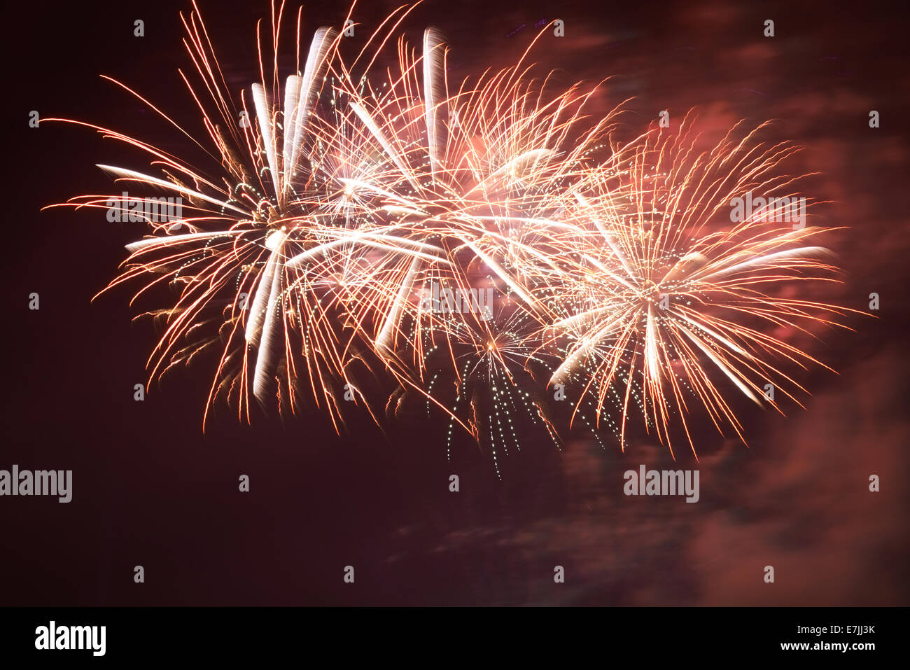 Red colorful fireworks on the black sky background Stock Photo - Alamy