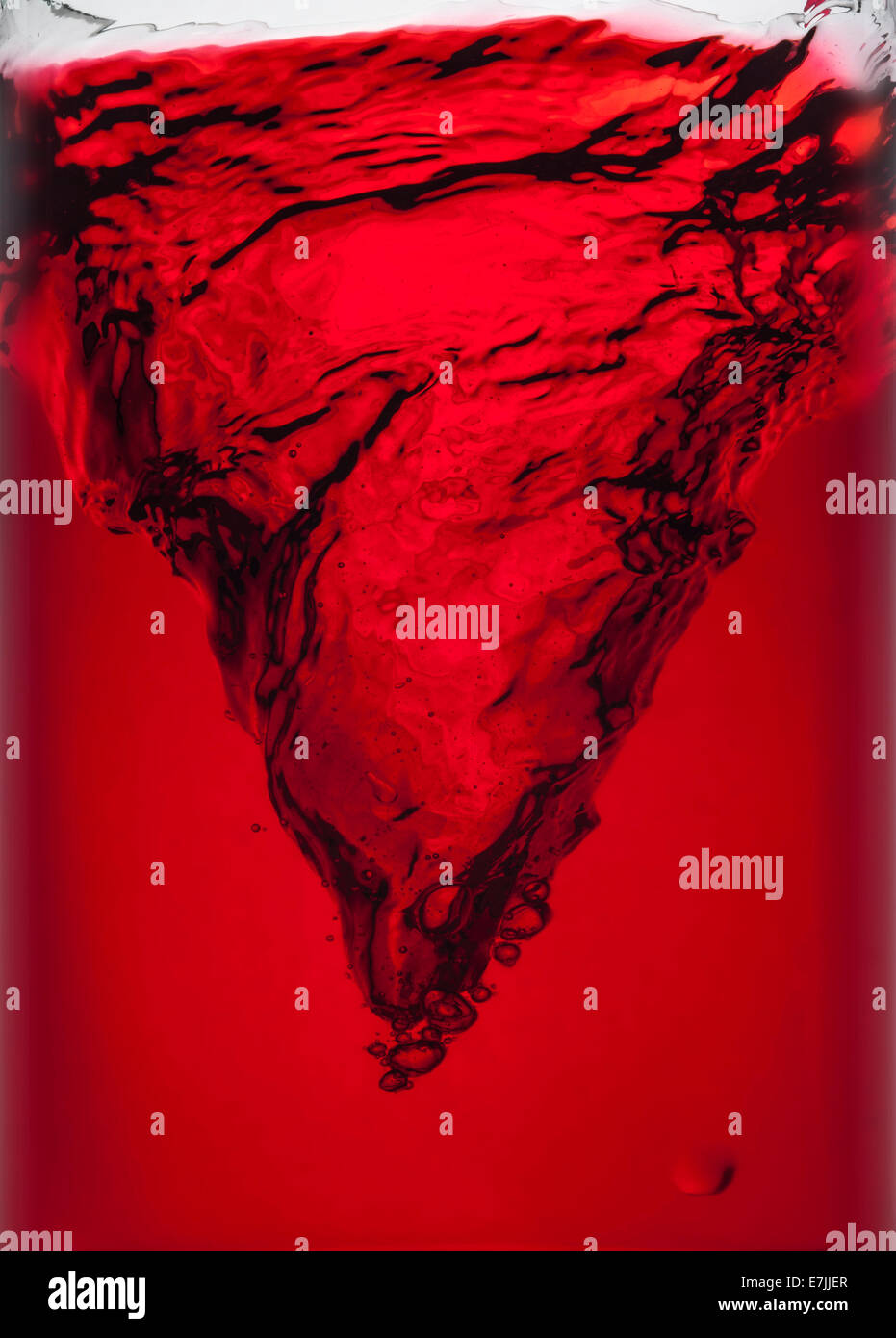 swirl of red liquid small typhoon Stock Photo - Alamy