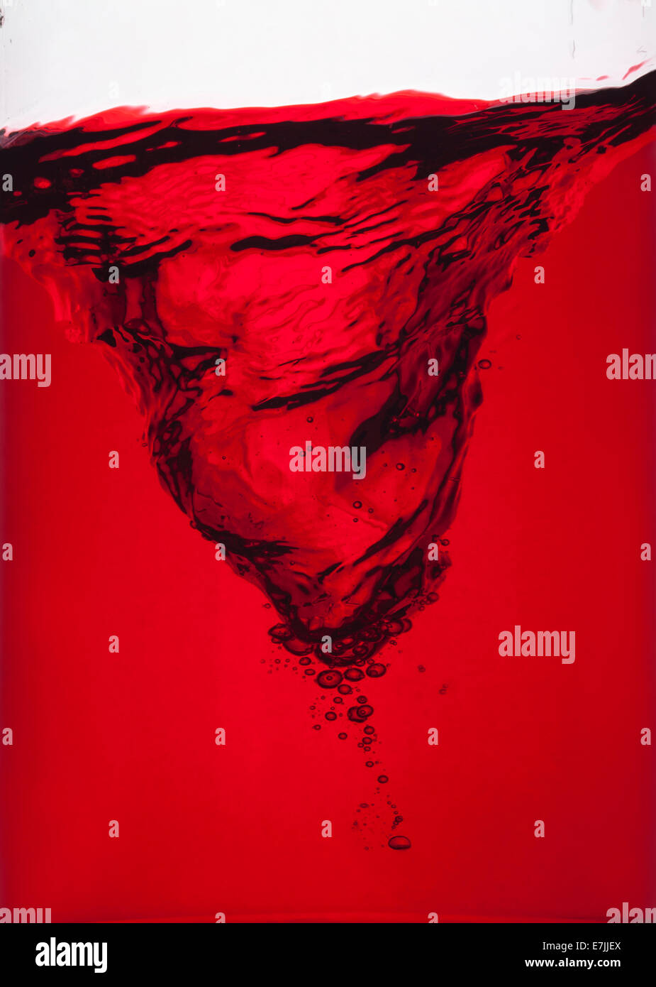 swirl of red liquid small typhoon Stock Photo - Alamy