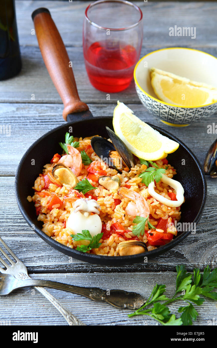 Tasty paella mussels and squid with black tiger prawns, top view Stock ...