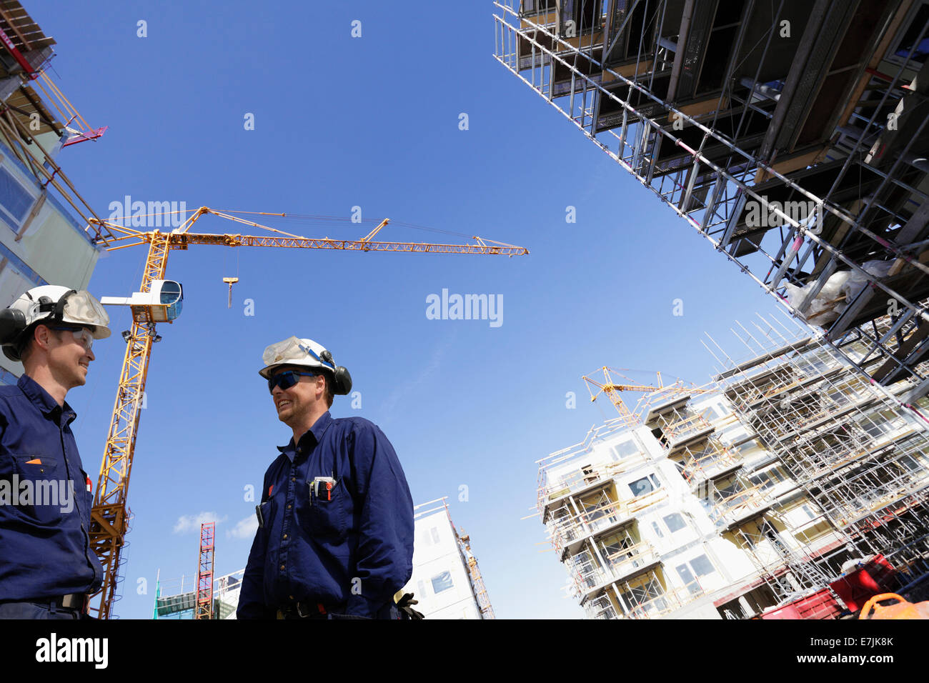building workers inside construction site Stock Photo - Alamy