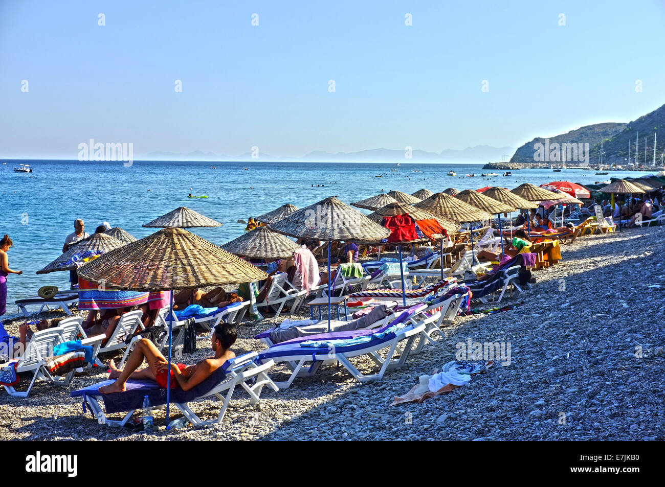 Natural beach with people Stock Photo - Alamy