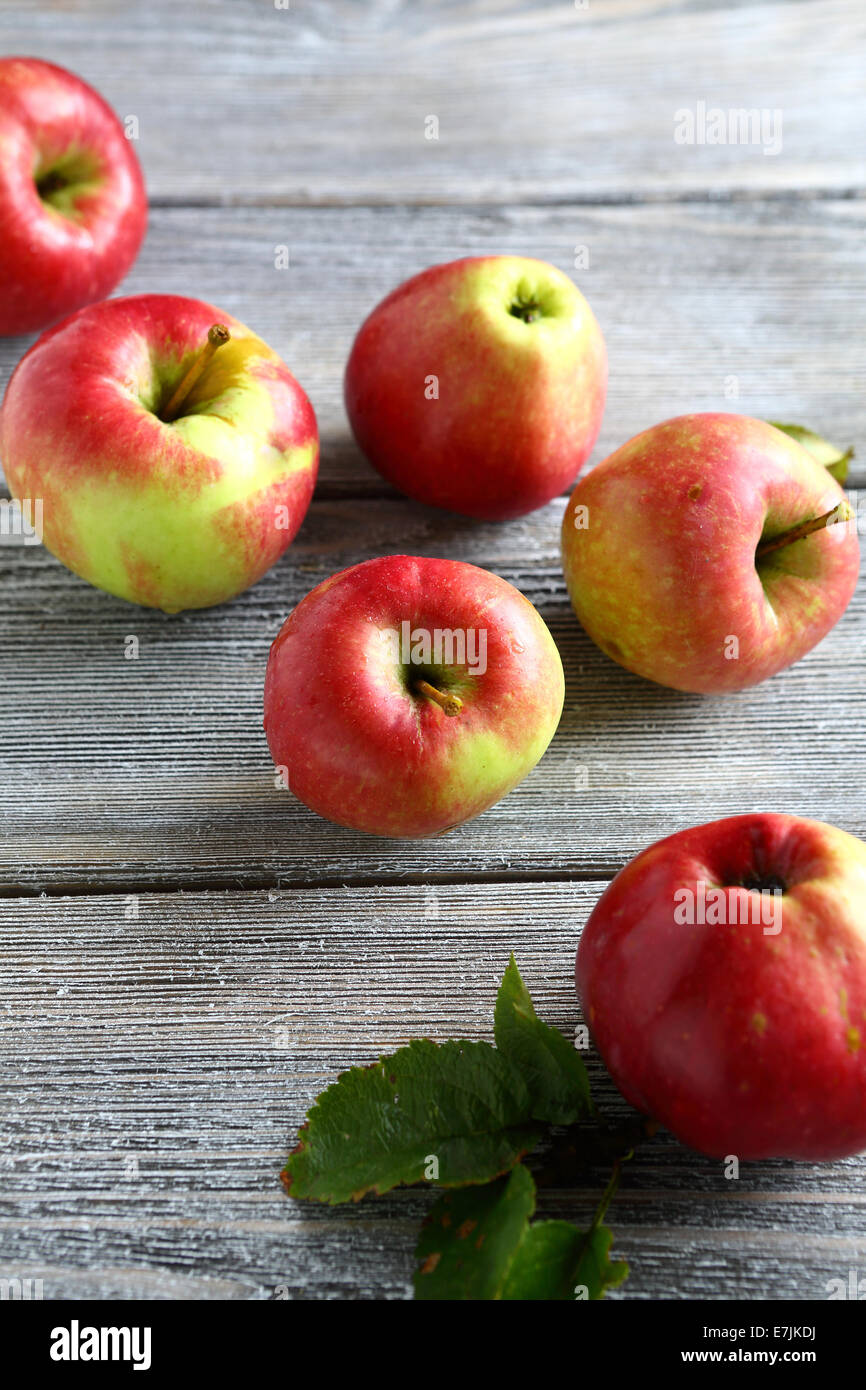Sweet red apples on wooden boards, closeup Stock Photo - Alamy