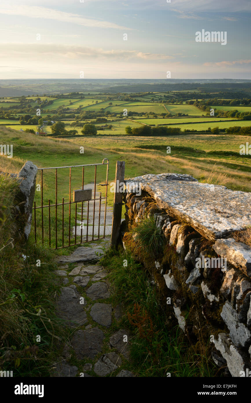 A stone pathway and metal gate leading to open countryside near Brentor ...