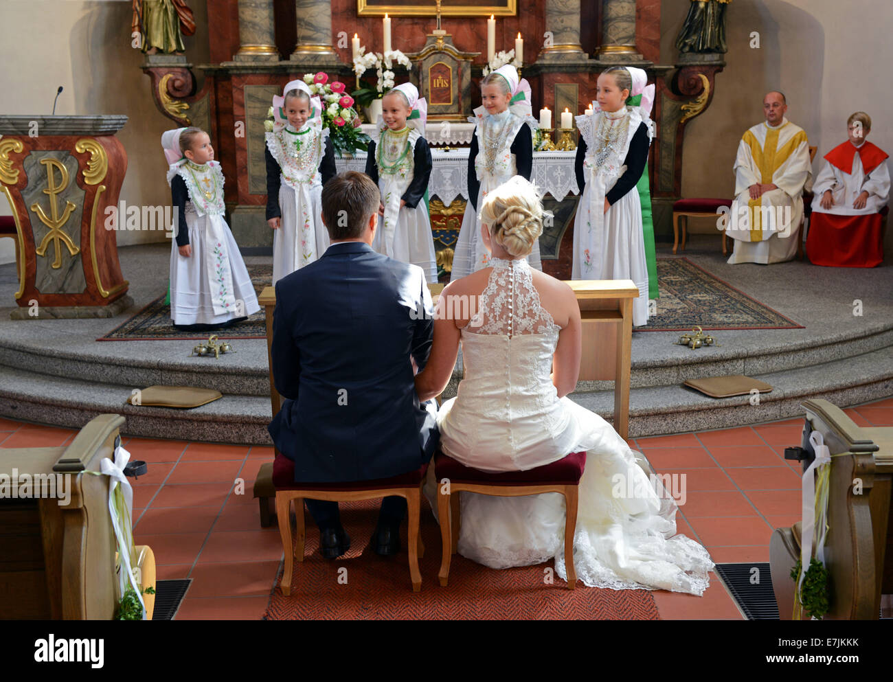 The Sorbian bridal couple Lubina Schkoda and Martin Rehor sits in front ...