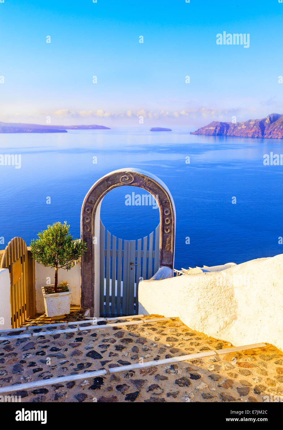 Santori gate facing the volcano in the sea Stock Photo - Alamy