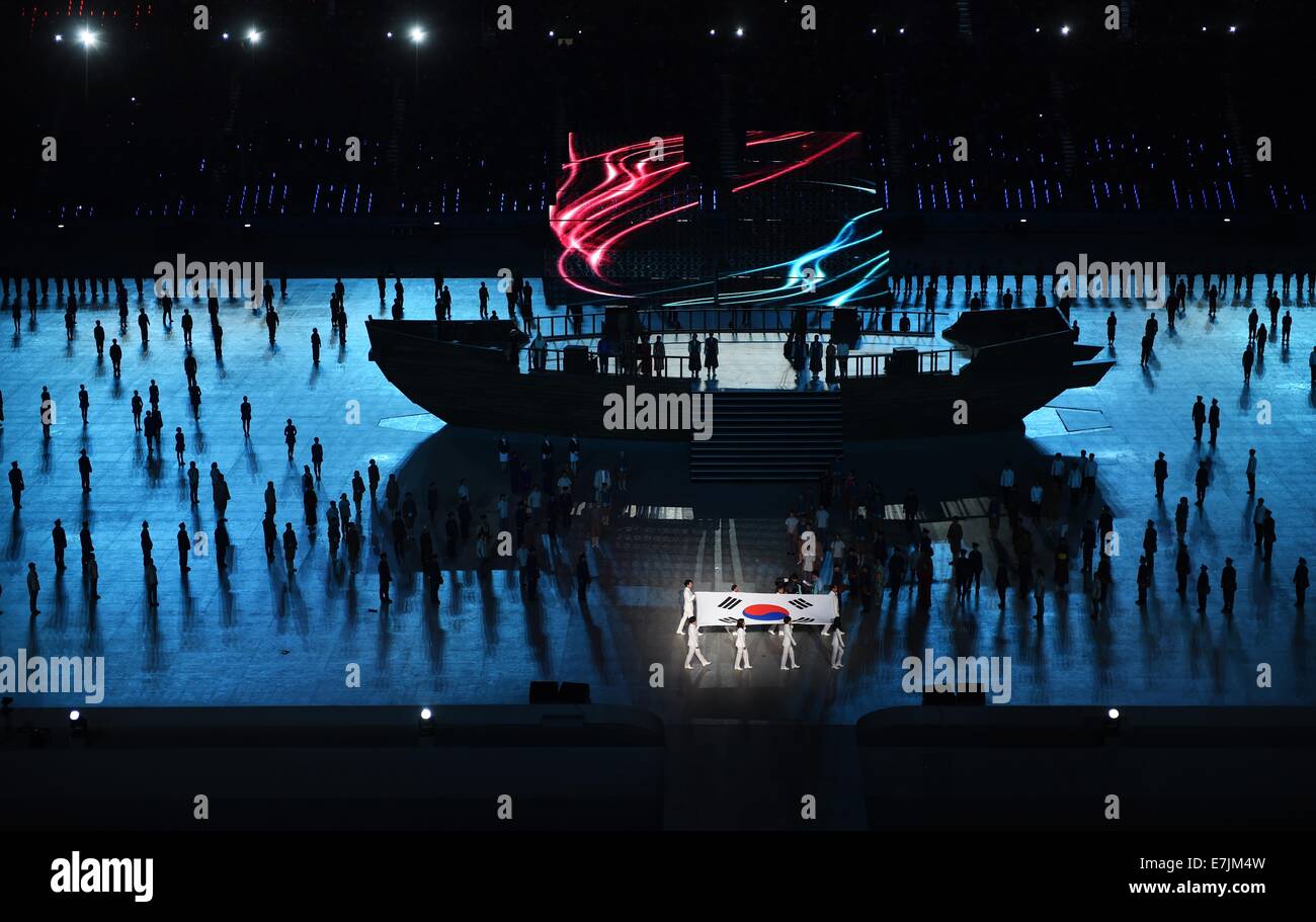 Incheon, South Korea. 19th Sep, 2014. Flag bearers carry the national ...