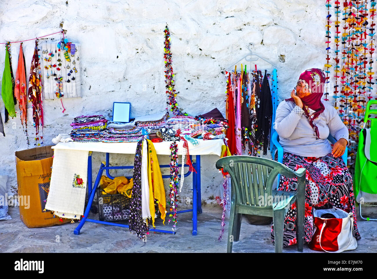Village woman selling hand-knitted gifts Stock Photo - Alamy
