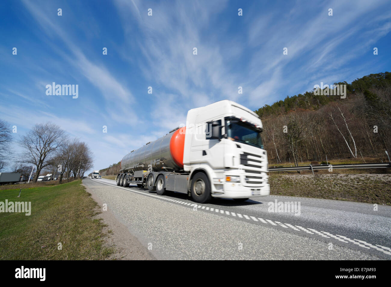 fuel truck driving on scenic country freeway Stock Photo - Alamy
