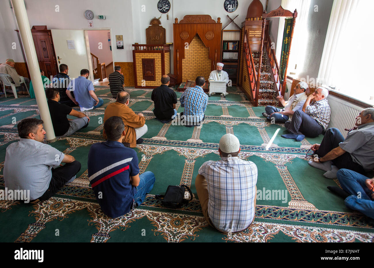 Members of the Turkish Islamic community meet for the traditional ...