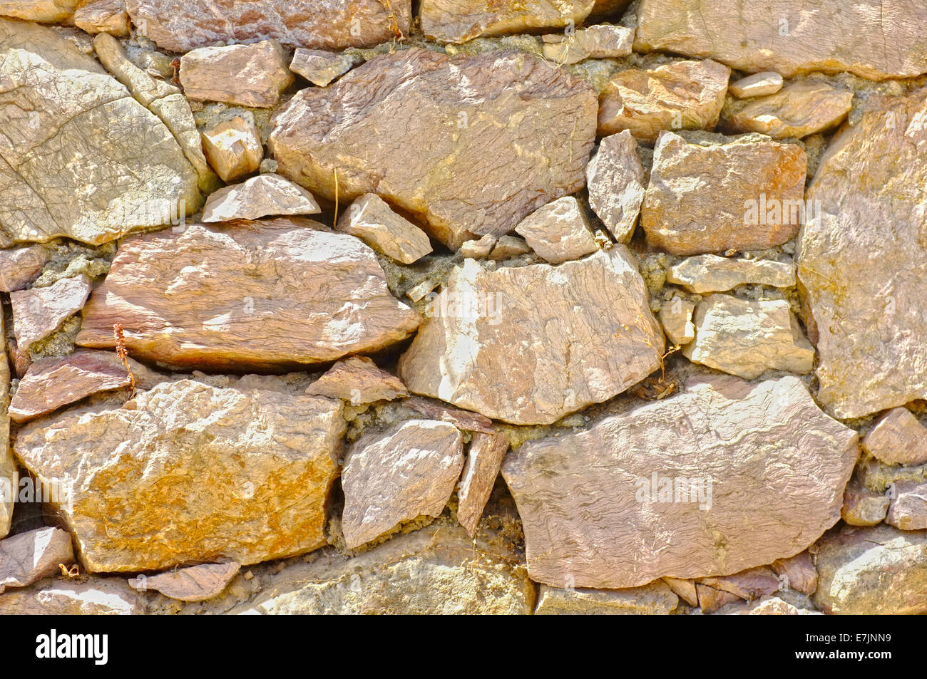 Wall made of stones Stock Photo - Alamy